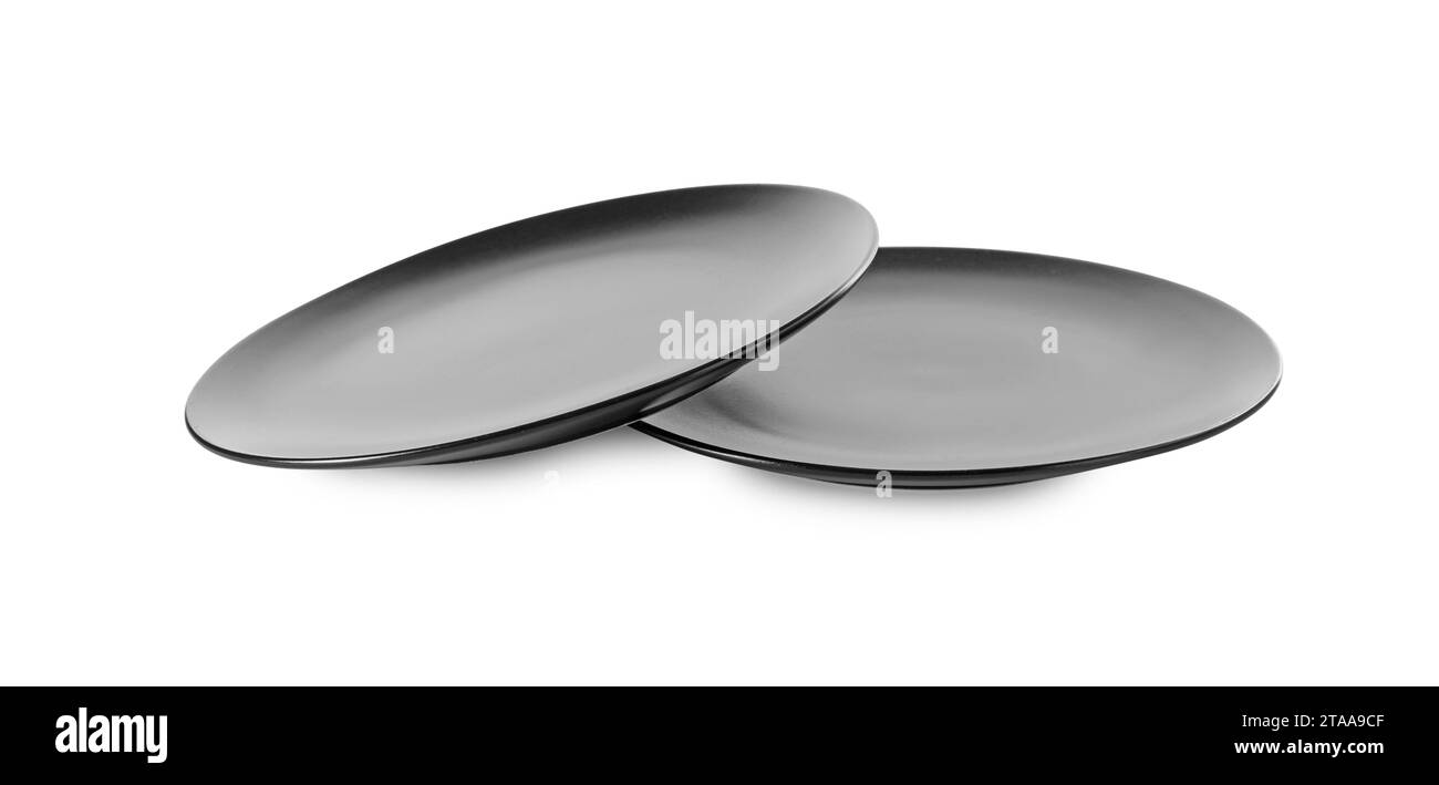 Two clean ceramic plates on white background Stock Photo - Alamy