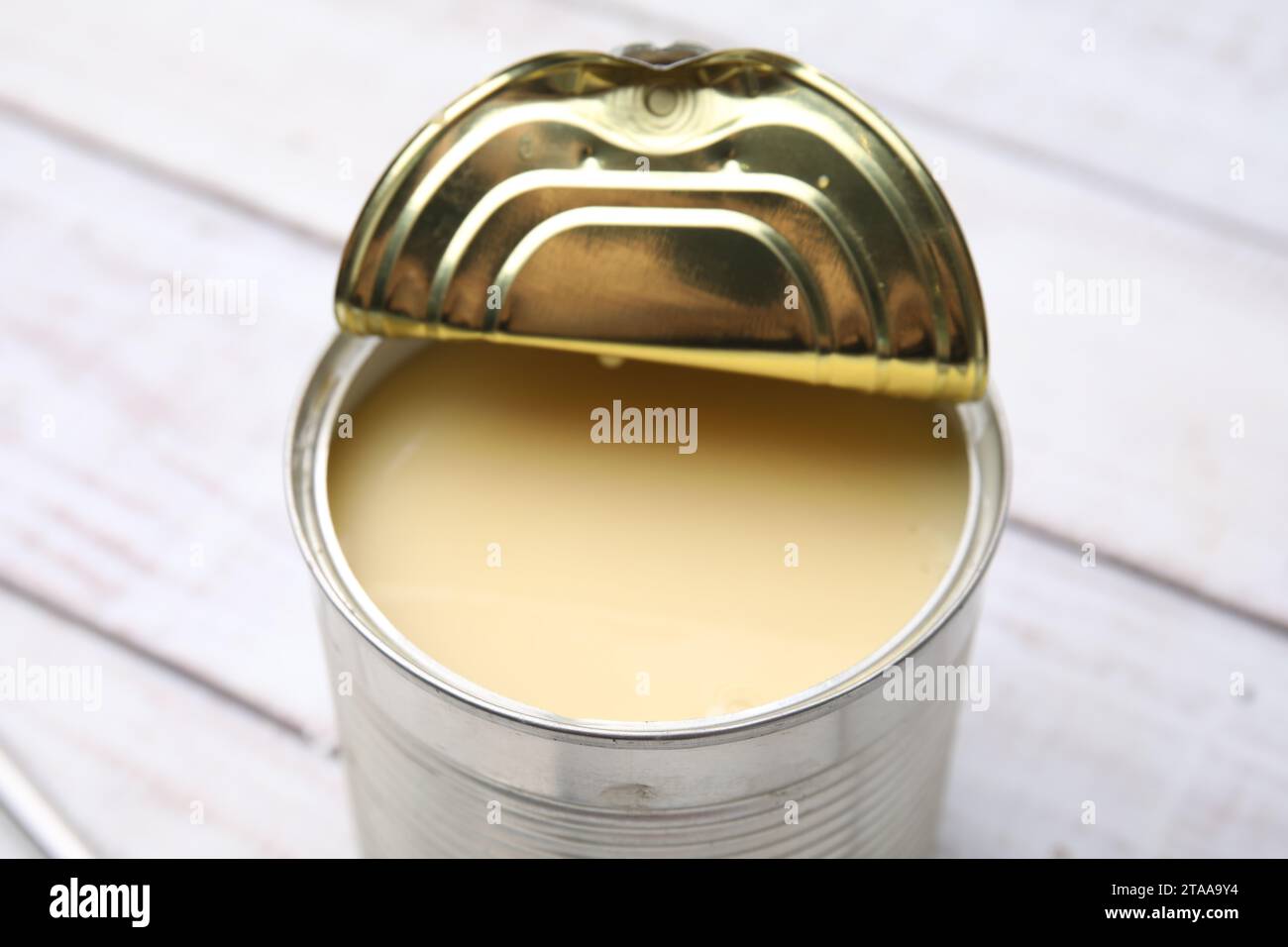 Condensed milk in tin can hi-res stock photography and images - Alamy