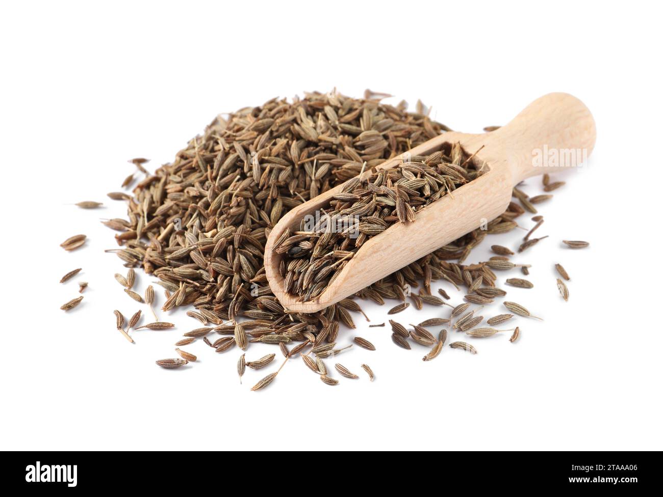 Scoop of aromatic caraway (Persian cumin) seeds isolated on white Stock ...