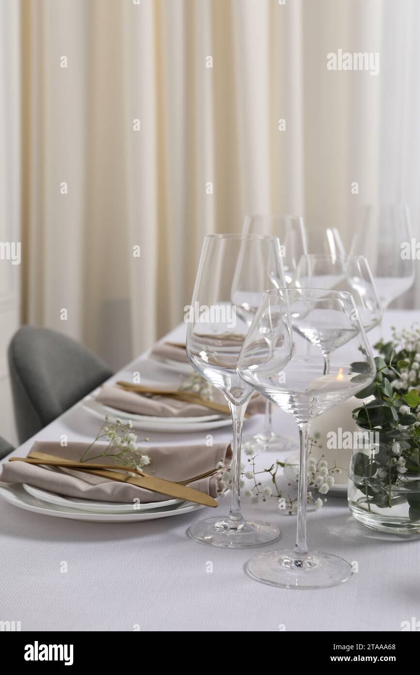 Beautiful table setting with floral decor indoors Stock Photo - Alamy