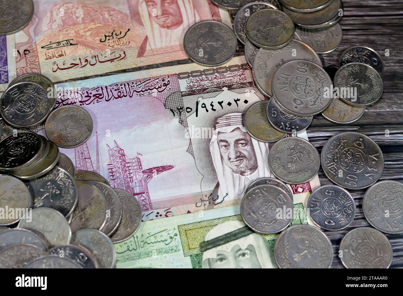 Saudi Arabia riyals money banknote bills and coins of different eras ...