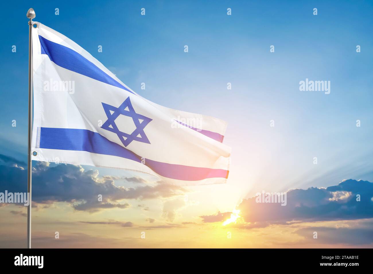 National flag of Israel against blue sky with clouds Stock Photo - Alamy
