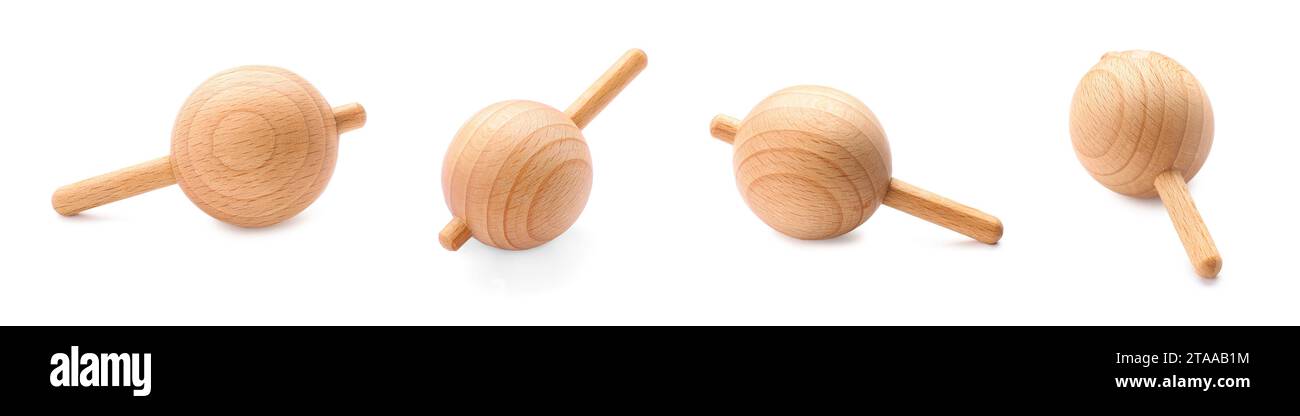 Many wooden spinning tops isolated on white. Toy whirligig Stock Photo ...