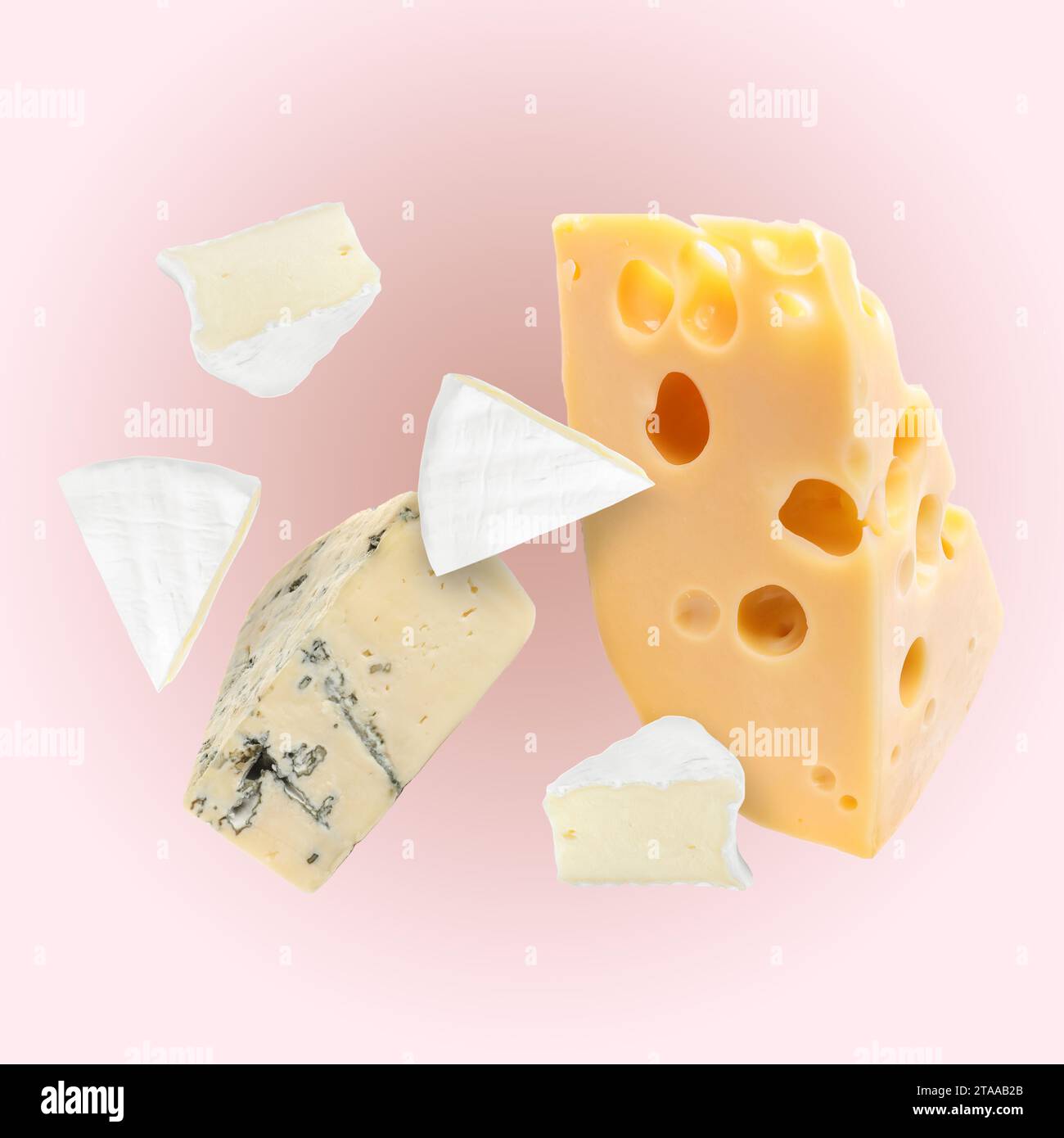 Different kinds of cheese falling on light pink background Stock Photo ...