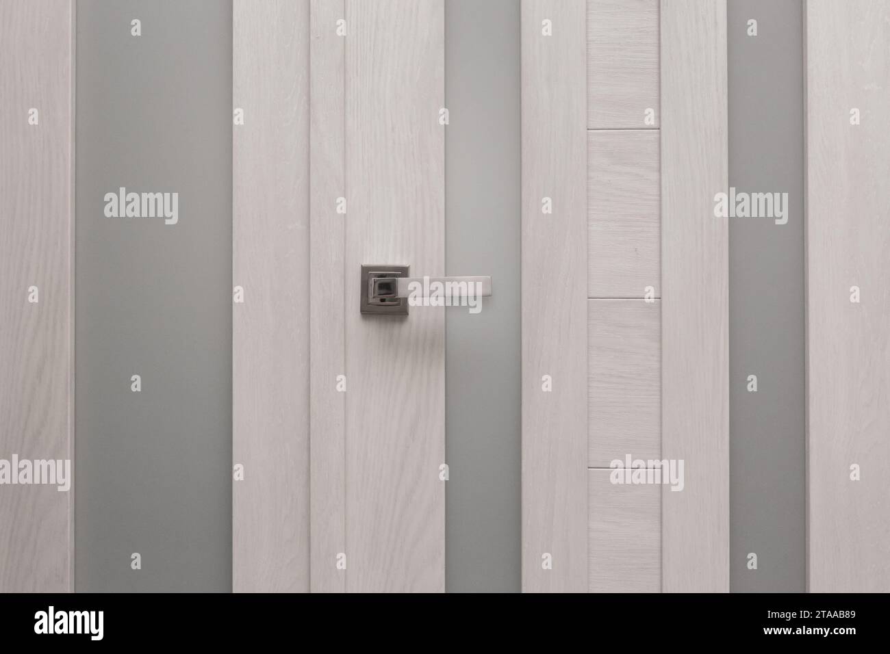 Silver metal color door handle made of white wood home exit house ...