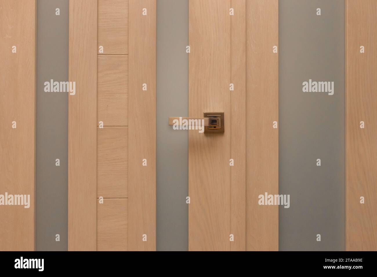 Silver metal color door handle made of yellow wood home exit house ...