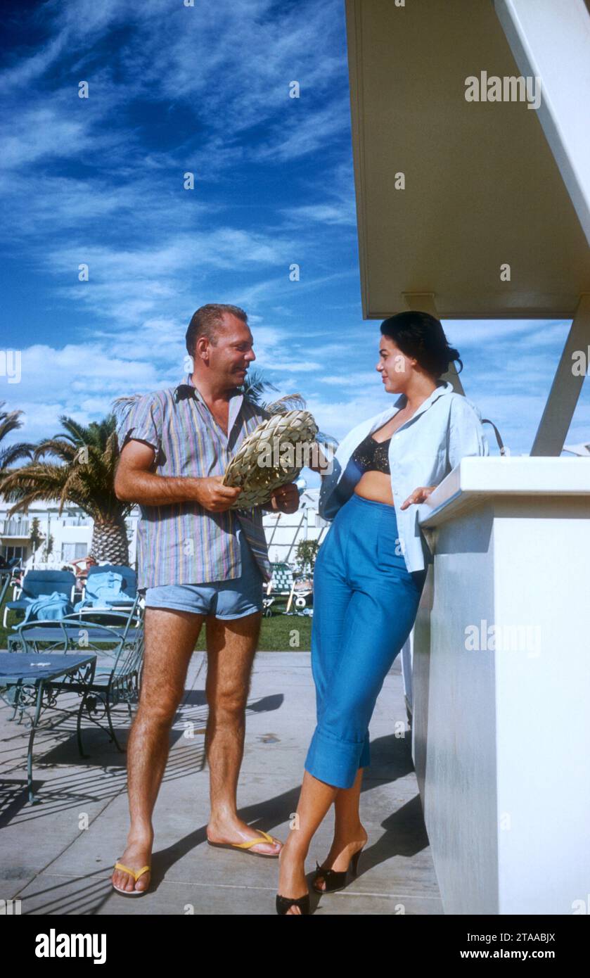 LAS VEGAS, NV - 1958: Actress and model Kitty Dolan talks to her friend ...