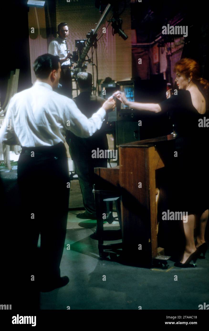 APRIL 23: American singer and actress Abbe Lane is handed a cigarette ...