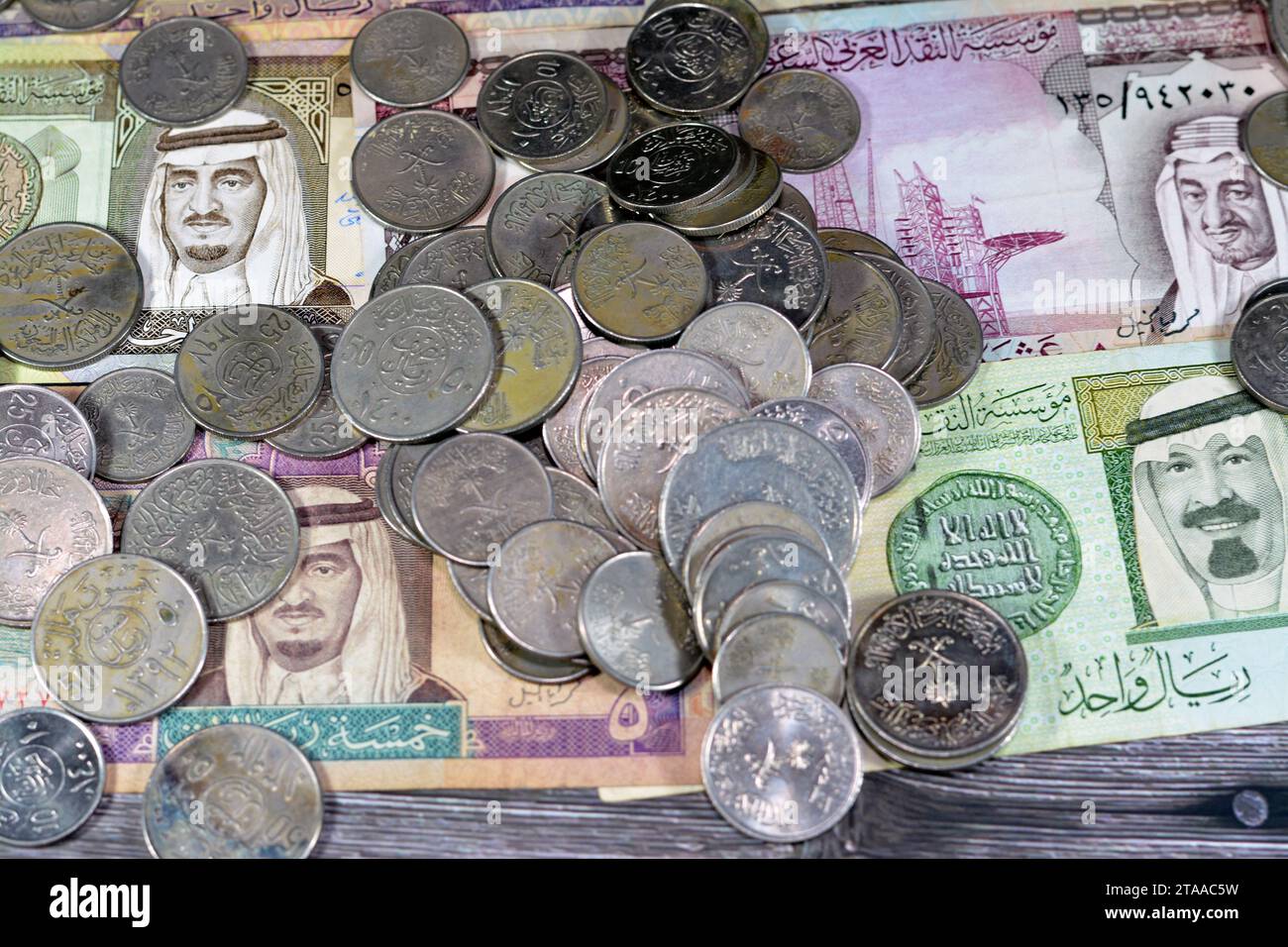 Saudi Arabia riyals money banknote bills and coins of different eras ...