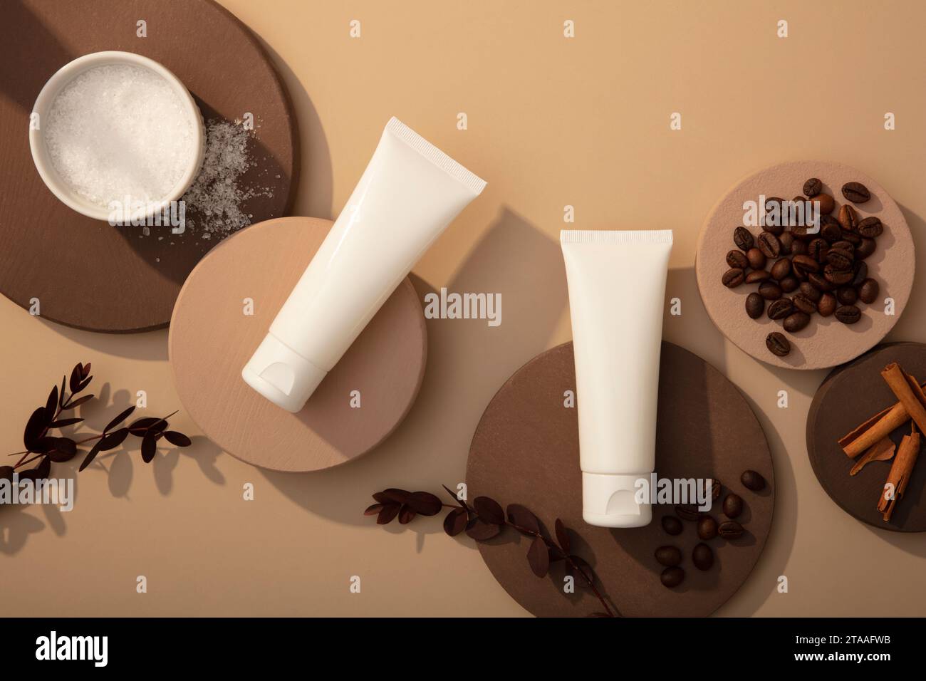 Mockup bottle of cosmetic displayed on round podiums with coffee beans ...