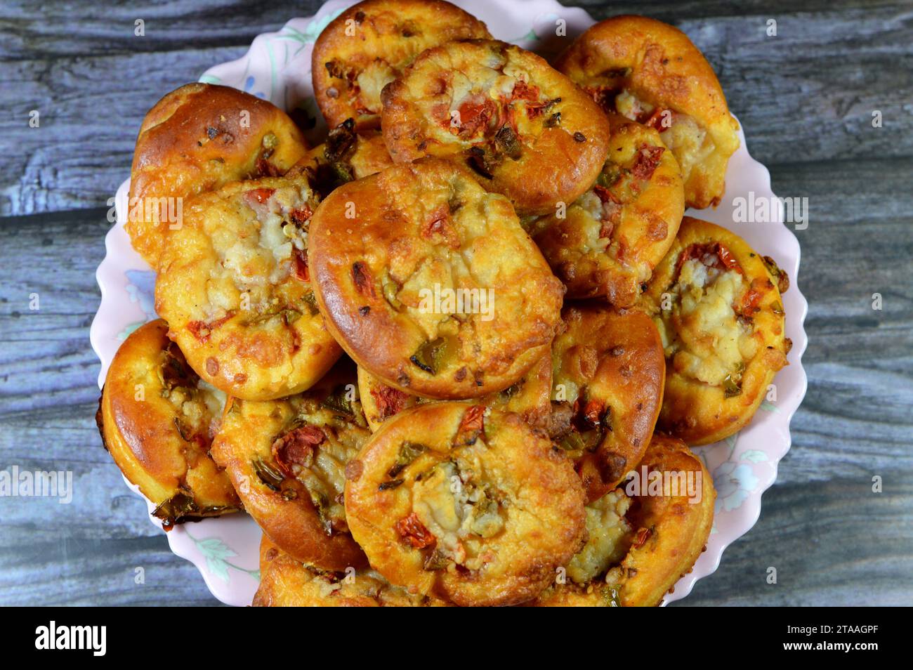 Pile of mini pizzas, Pizza is a dish of Italian origin consisting of a usually round, flat base ...