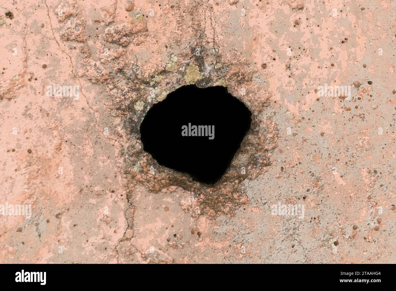 Hole circle round in concrete color old dirty wall, isolated black ...