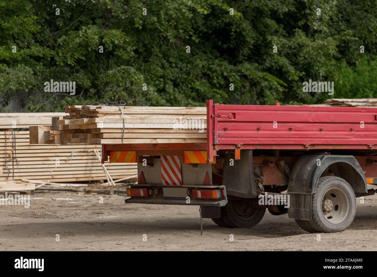 Car automobile with trailer wooden planks material. Wood Industry and ...