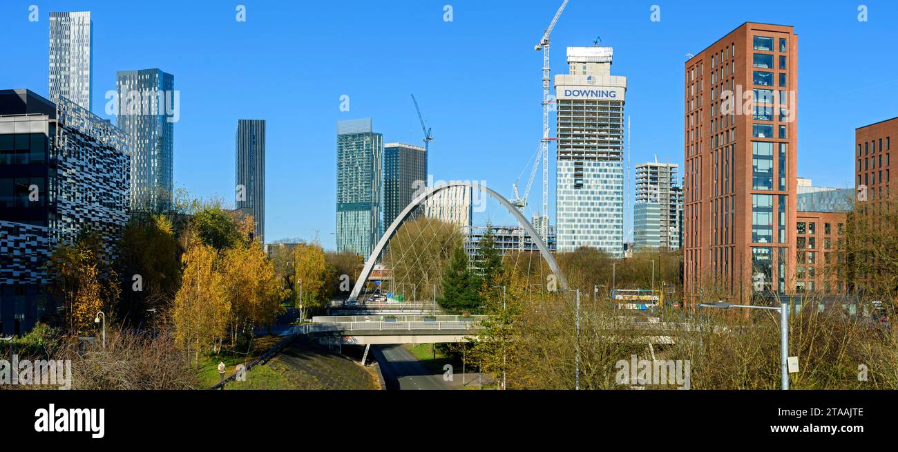 Tower blocks of Manchester city centre skyline over the Hulme Arch ...