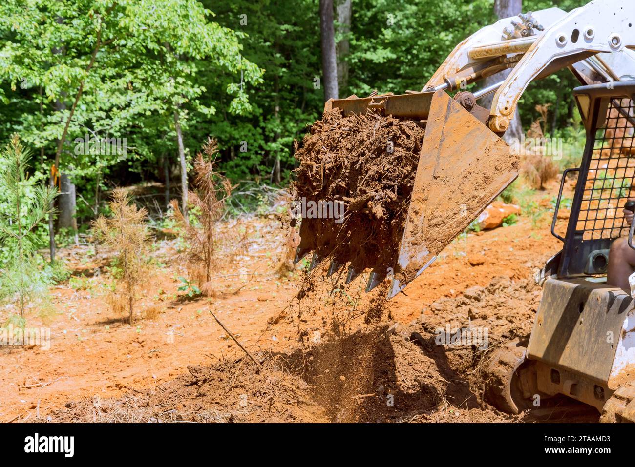 Using bulldozer mini working with earth, moving soil, improving ...