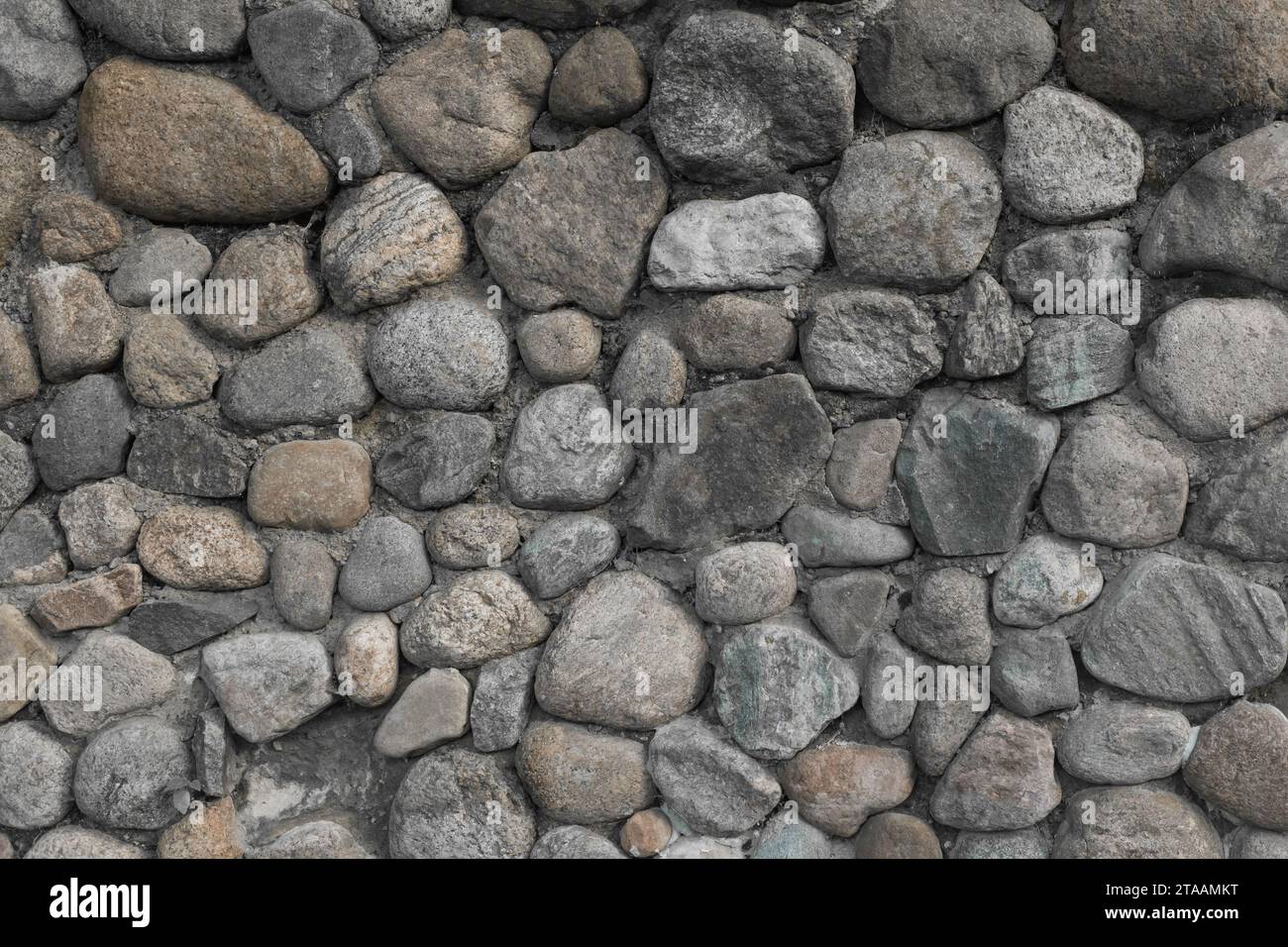 Stones grey cobblestones cement wall solid texture background rough street Stock Photo - Alamy