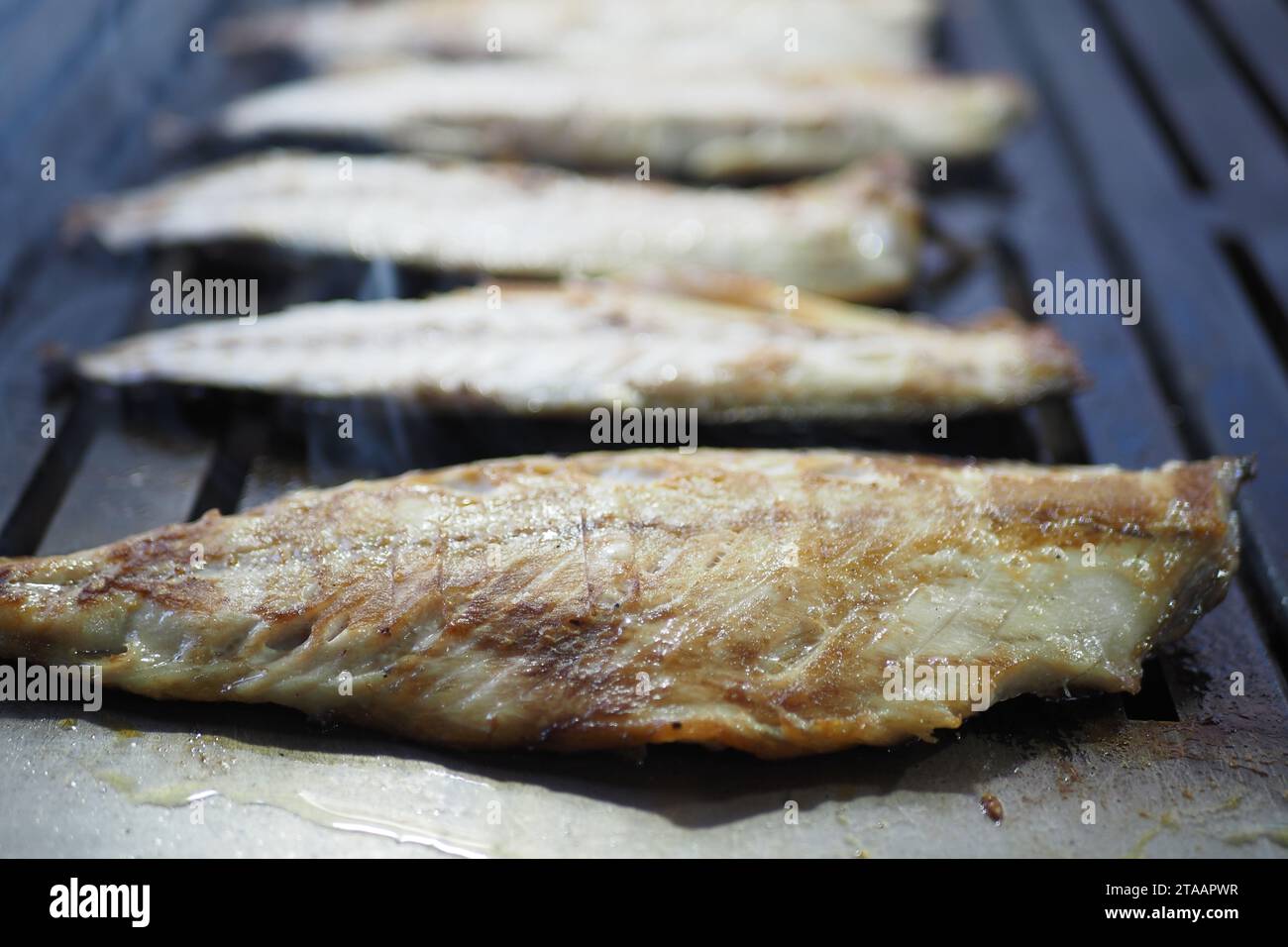 Baking and roasting fish on barbecue grill Stock Photo - Alamy