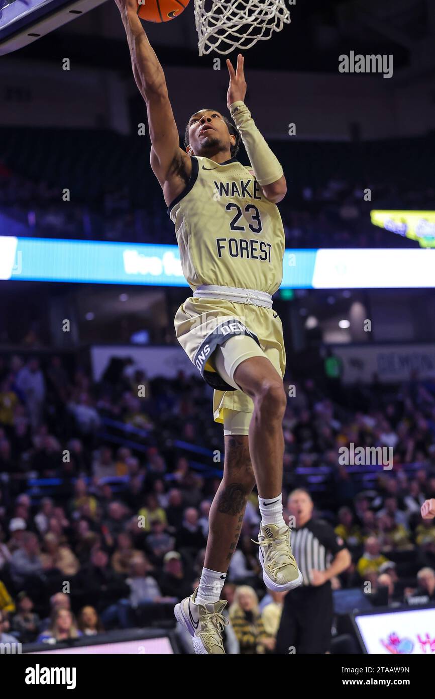 November 29, 2023: Wake Forest junior Hunter Sallis (23) goes up for ...
