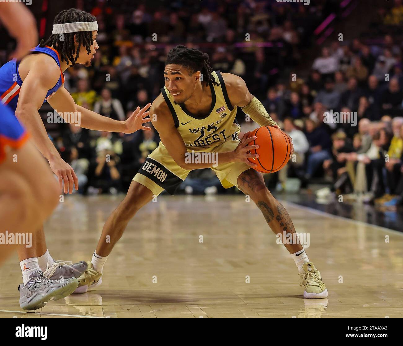 November 29, 2023: Wake Forest junior Hunter Sallis (23) looks to drive ...
