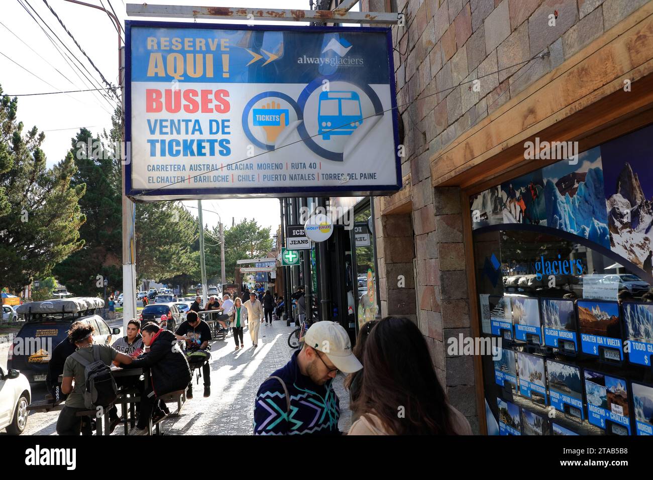 A bus ticket office sign over the sidewalk of Avenida del Libertador ...