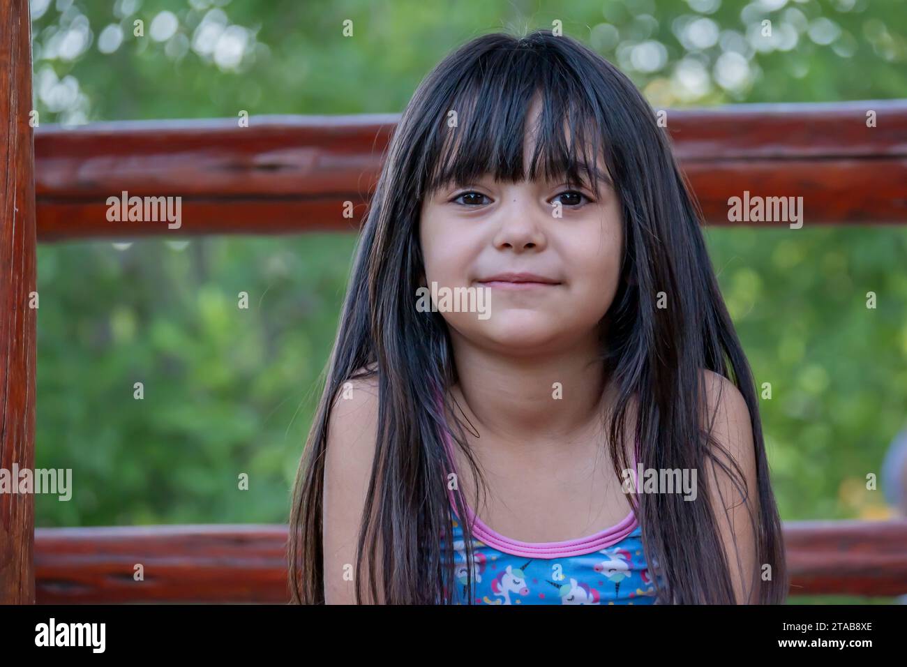 Portrait of a cute Argentinian girl with long hair, who plays in the ...