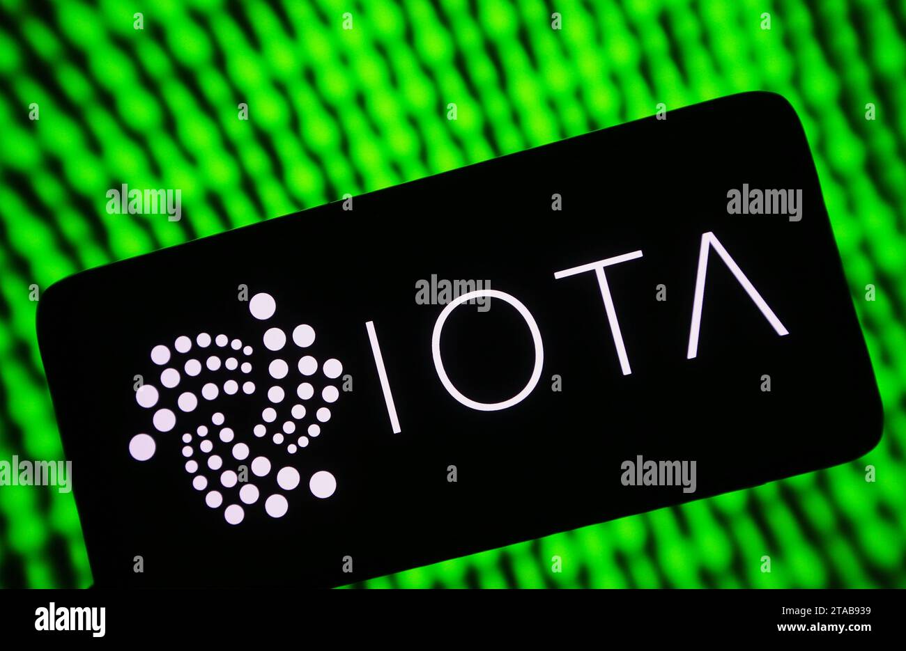 Ukraine. 29th Nov, 2023. In this photo illustration, IOTA logo is seen ...