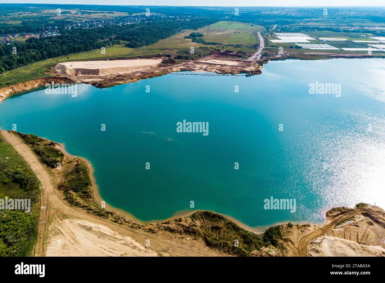 A flooded sand pit with turquoise water. View from high altitude Stock ...