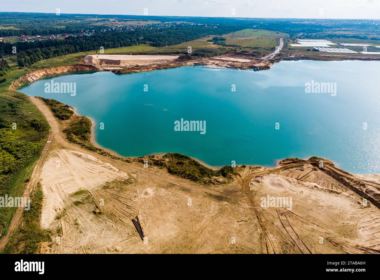 A flooded sand pit with turquoise water. View from high altitude Stock ...