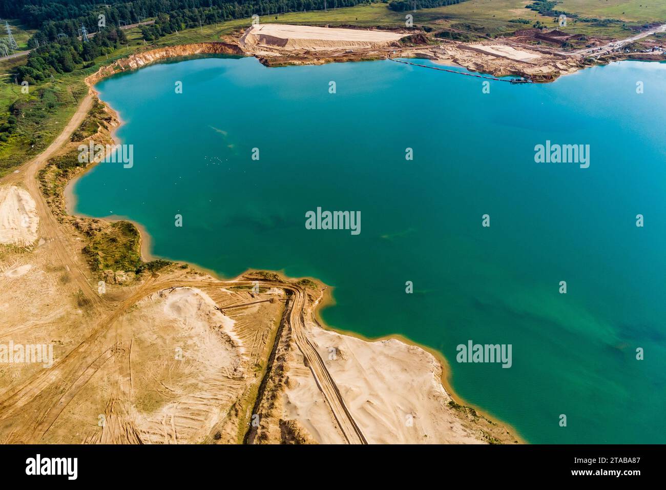 Aerial view of a flooded sand quarry with blue water Stock Photo - Alamy