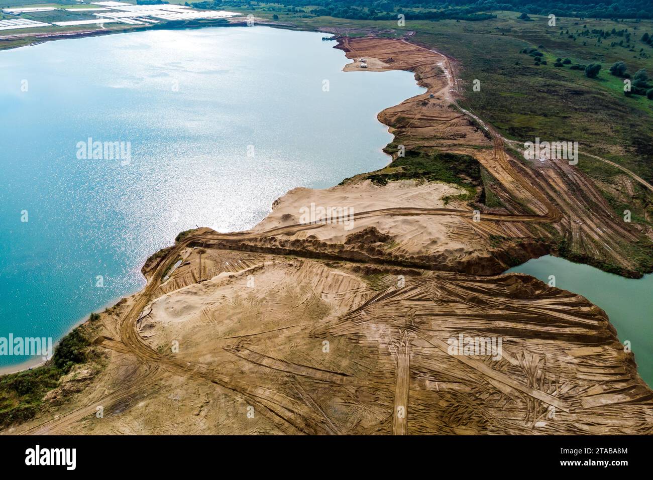 Aerial view of a flooded sand quarry with blue water Stock Photo - Alamy