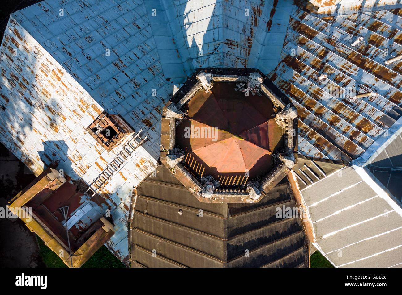Aerial view of the roof of an old manor house with a turret and spire ...