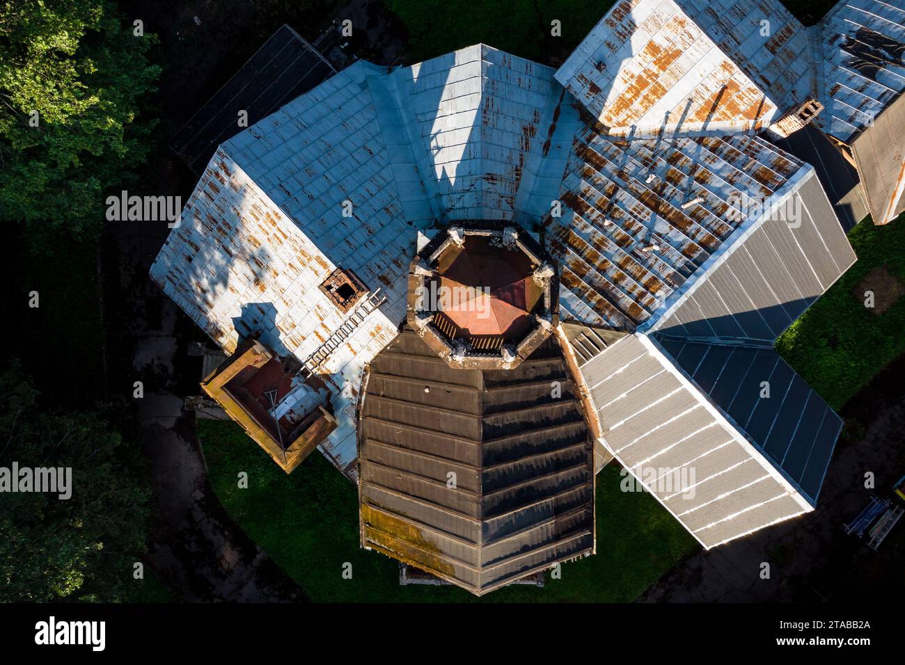 Aerial view of the roof of an old manor house with a turret and spire ...