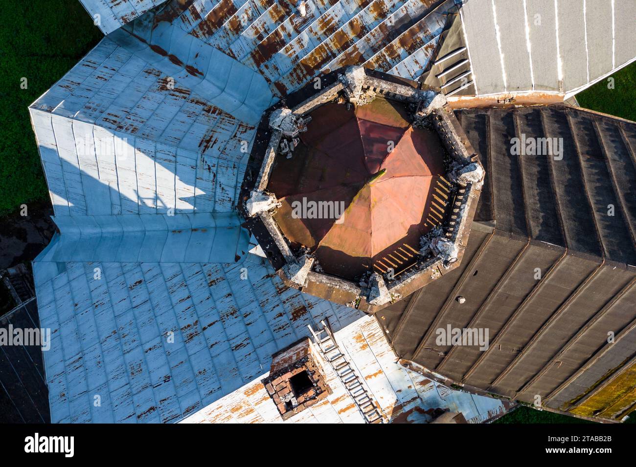 Aerial view of the roof of an old manor house with a turret and spire ...