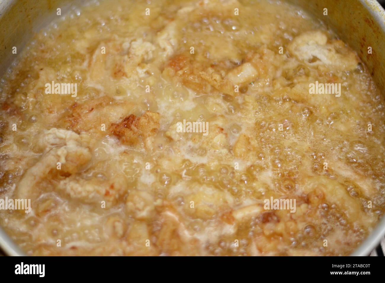 fried squid, a mollusc with an elongated soft body, large eyes, eight ...