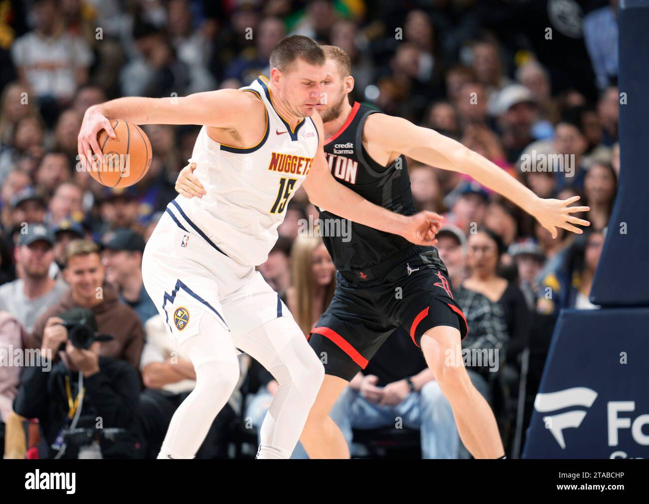 Denver Nuggets center Nikola Jokic, left, battles for position with ...