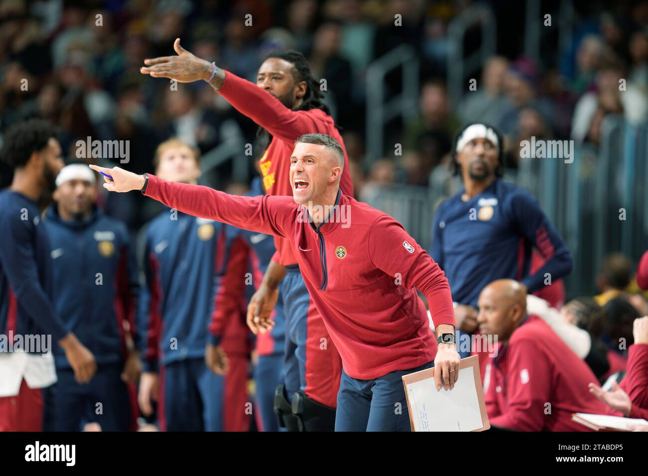 Denver Nuggets assistant coach Ryan Saunders, center, directs players ...