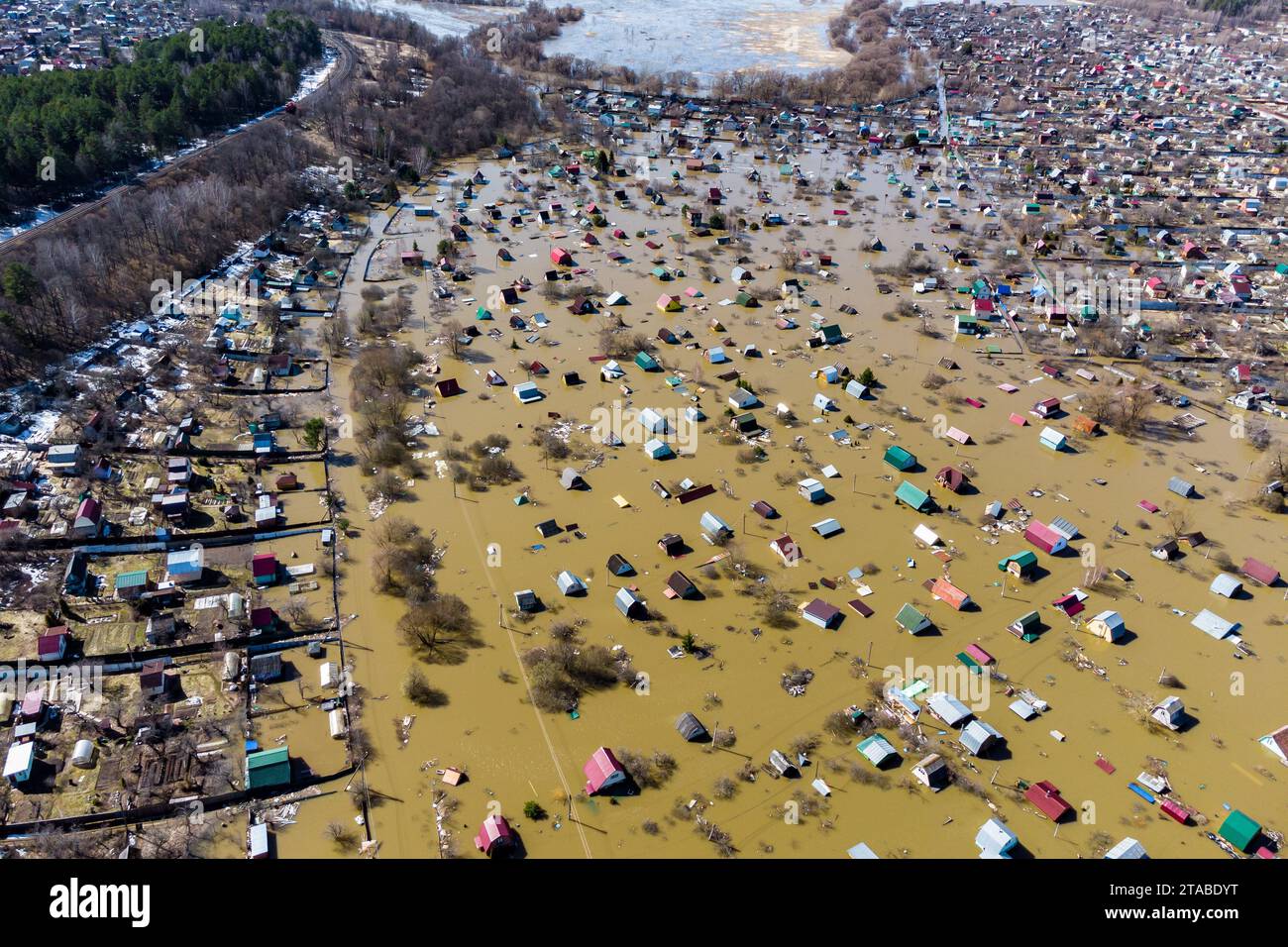 A large area with country houses flooded with water during the spring ...