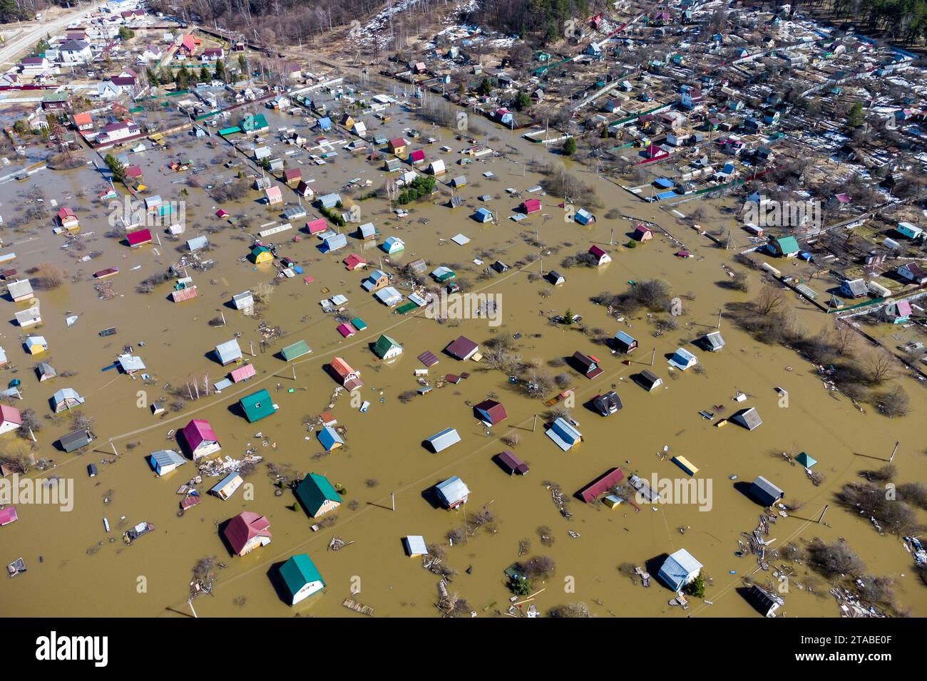 A large area with country houses flooded with water during the spring ...