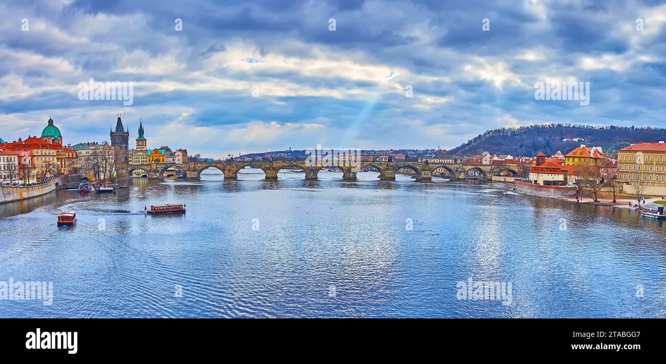 City panorama with Vltava River, floating tourist boats and medieval ...