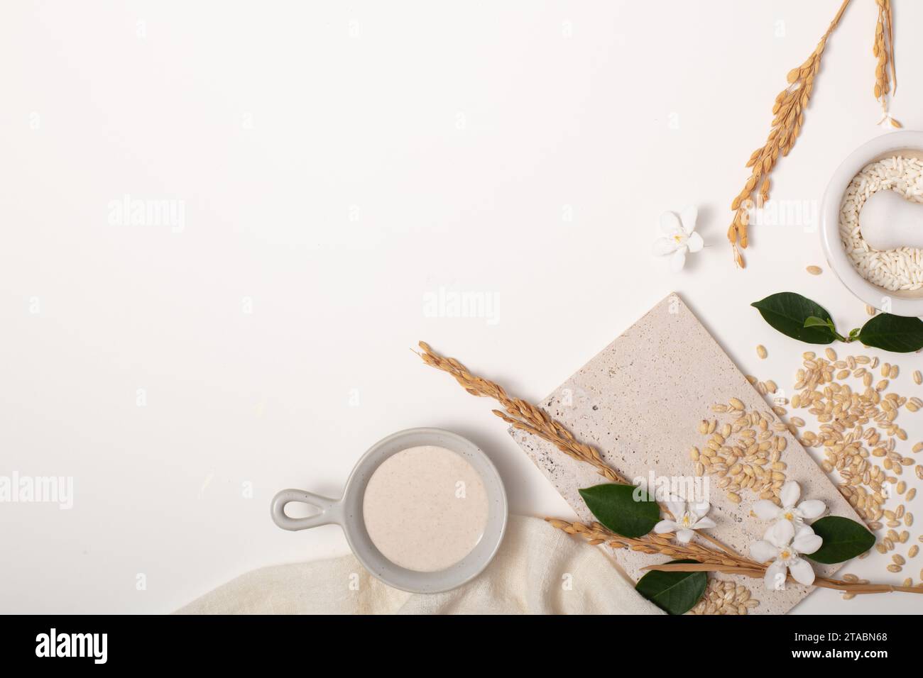 Rice bran and props on white background. Ideal space for displaying ...