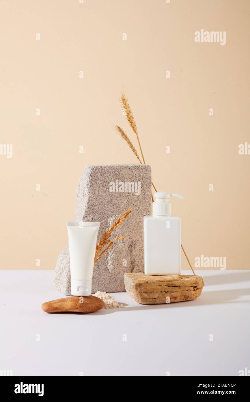 A set of unlabeled cosmetics is placed on a stone platform with whole ...