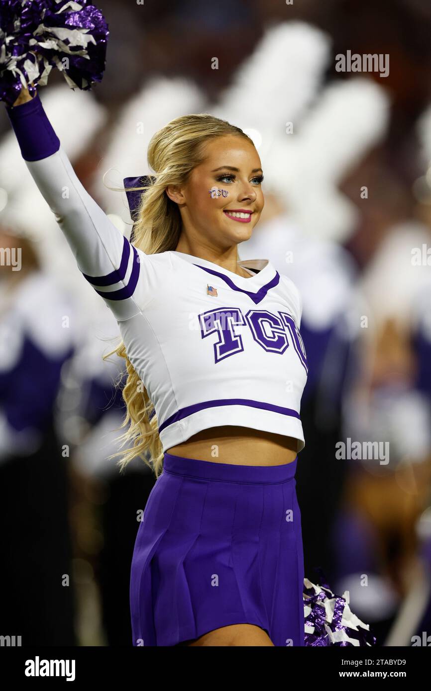 A TCU cheerleader cheers during an NCAA college football game against ...