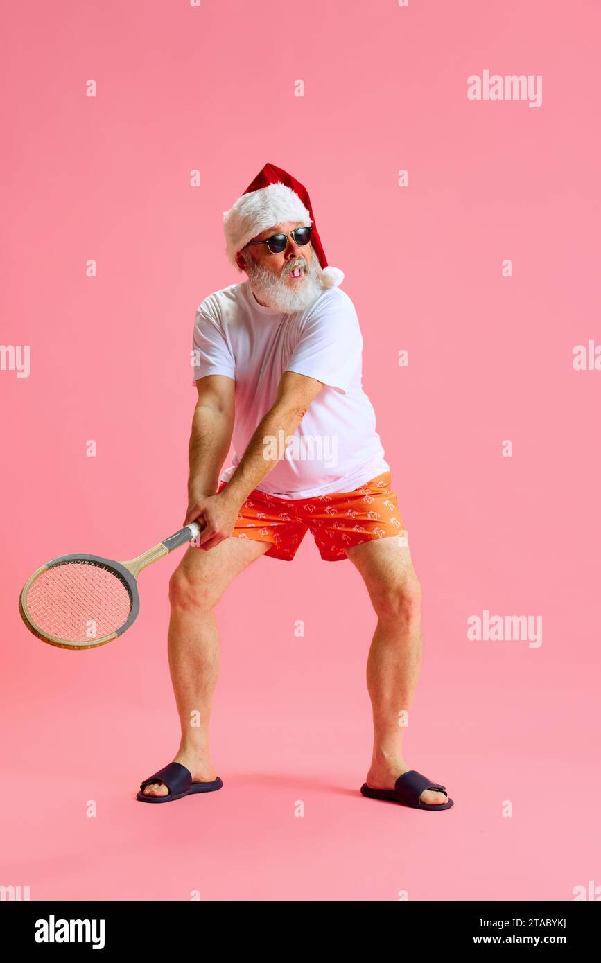 Full size portrait of Santa Claus dressed for summer spends winter ...