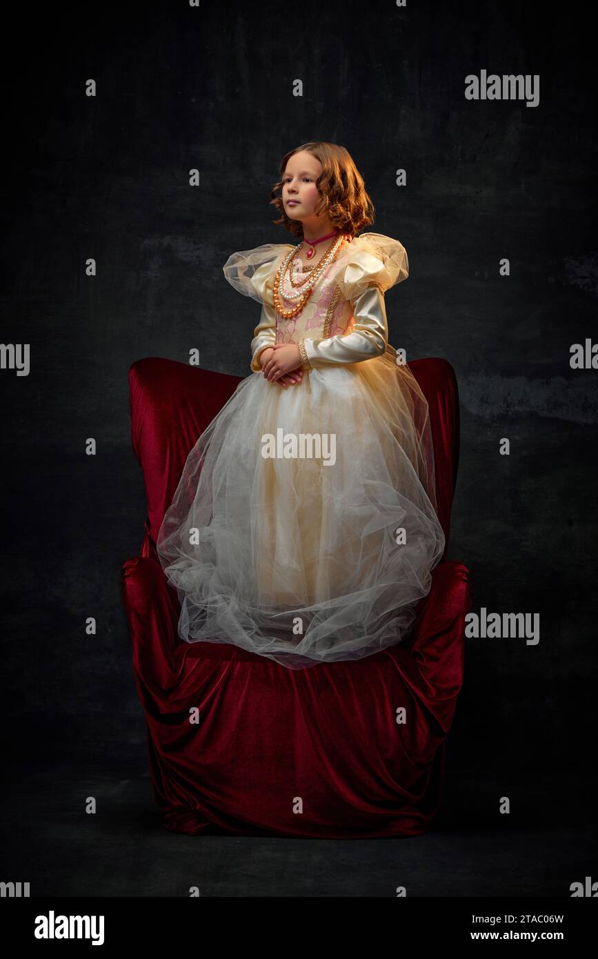 Portrait of little girl, kid dressed like aristocratic medieval person ...