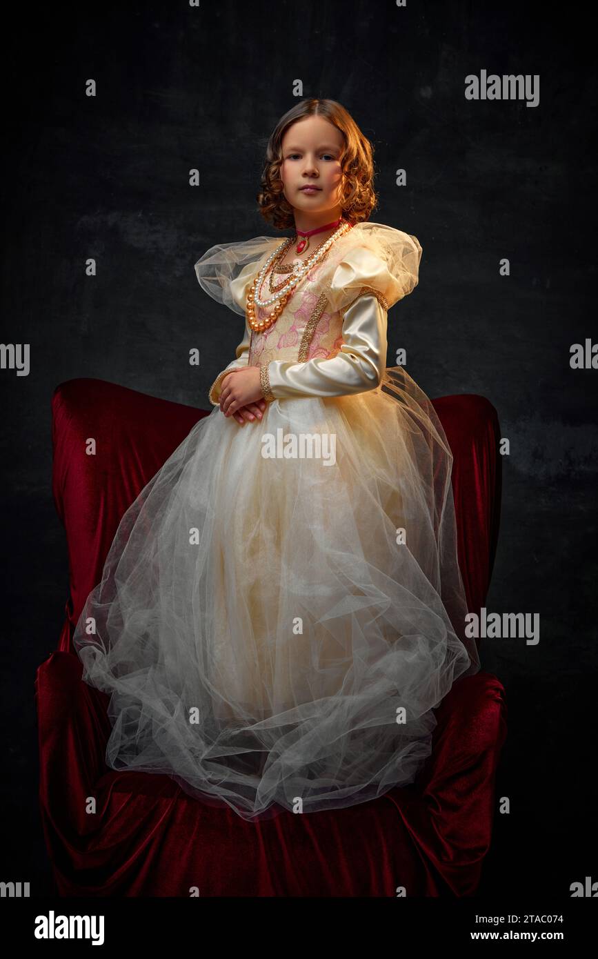Portrait of one little girl, kid dressed like aristocratic royal person ...