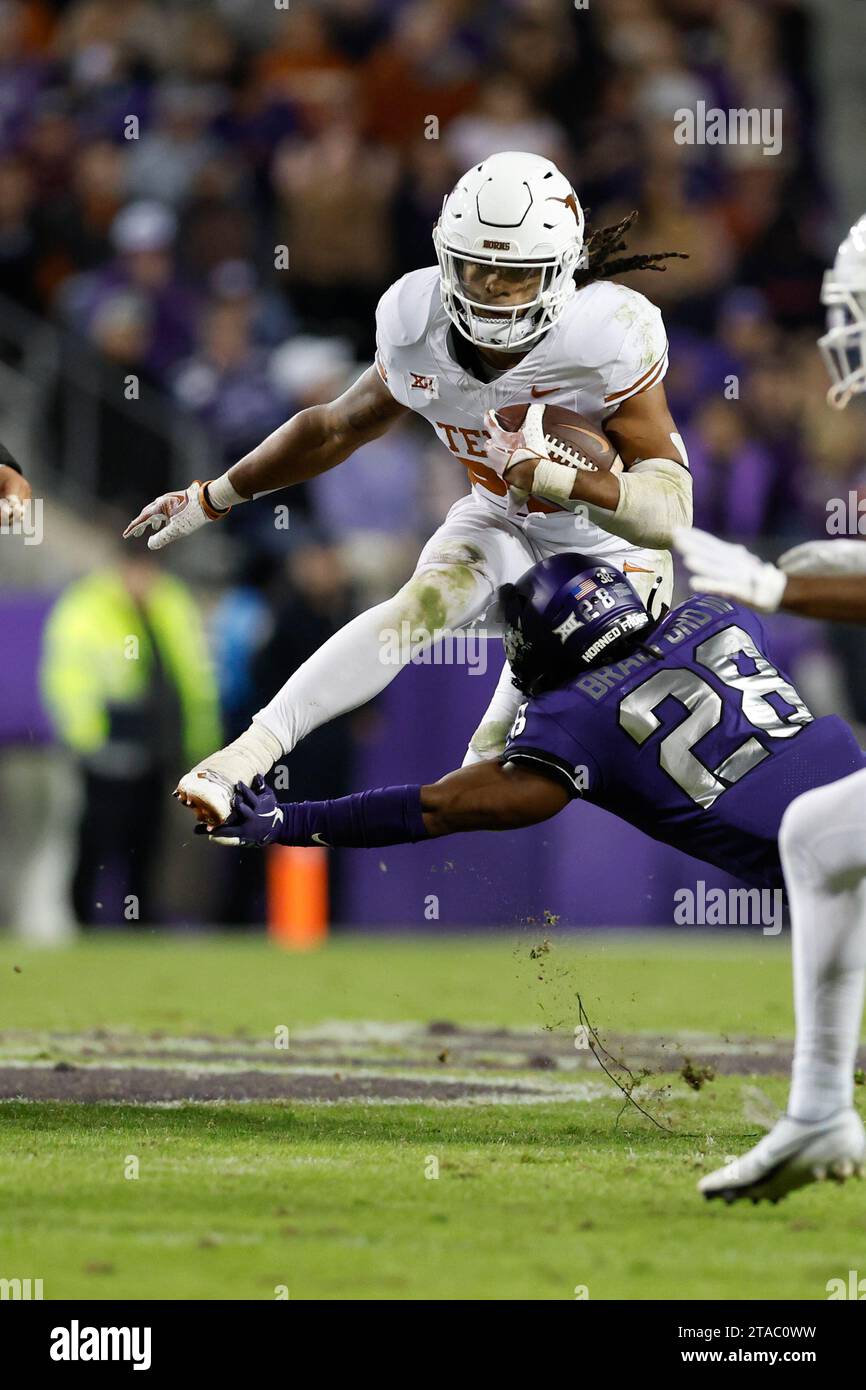 Texas running back Jonathon Brooks (24) carries the ball as he tries to ...