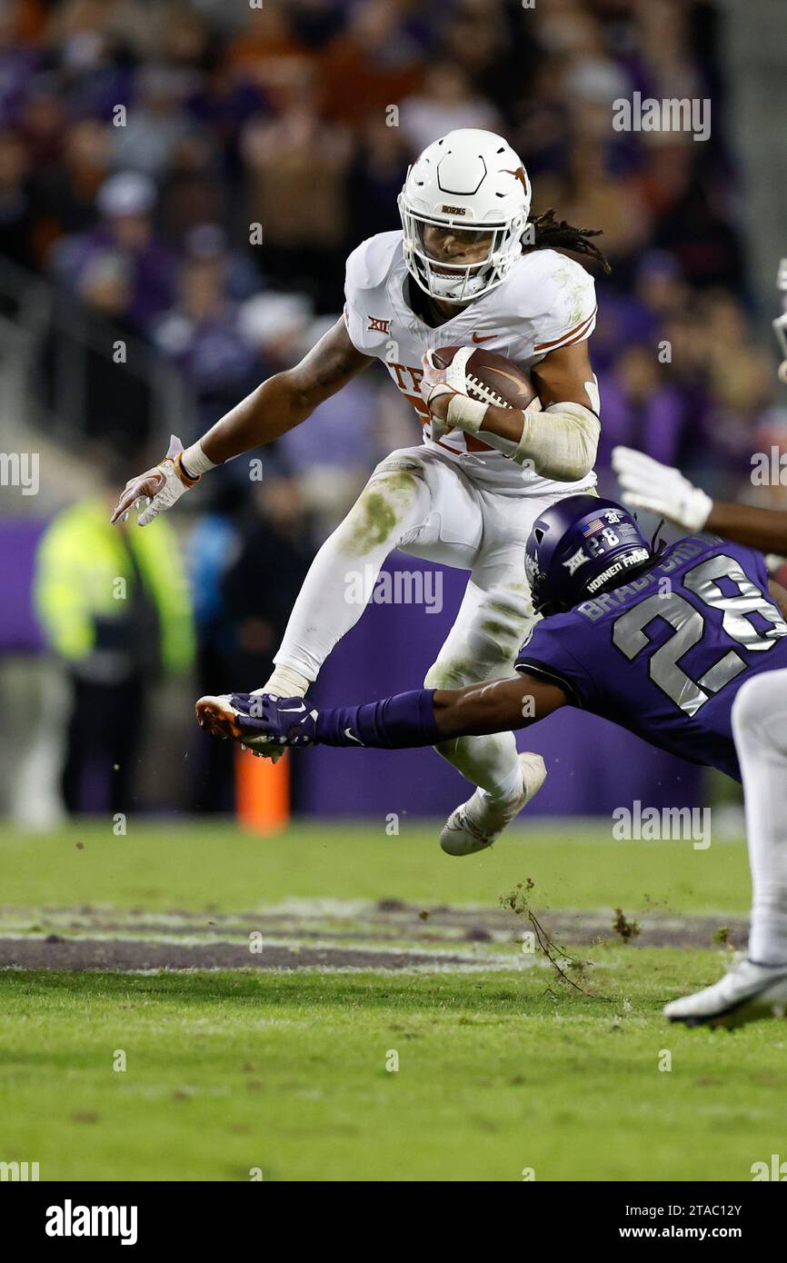 Texas running back Jonathon Brooks (24) carries the ball as he tries to ...