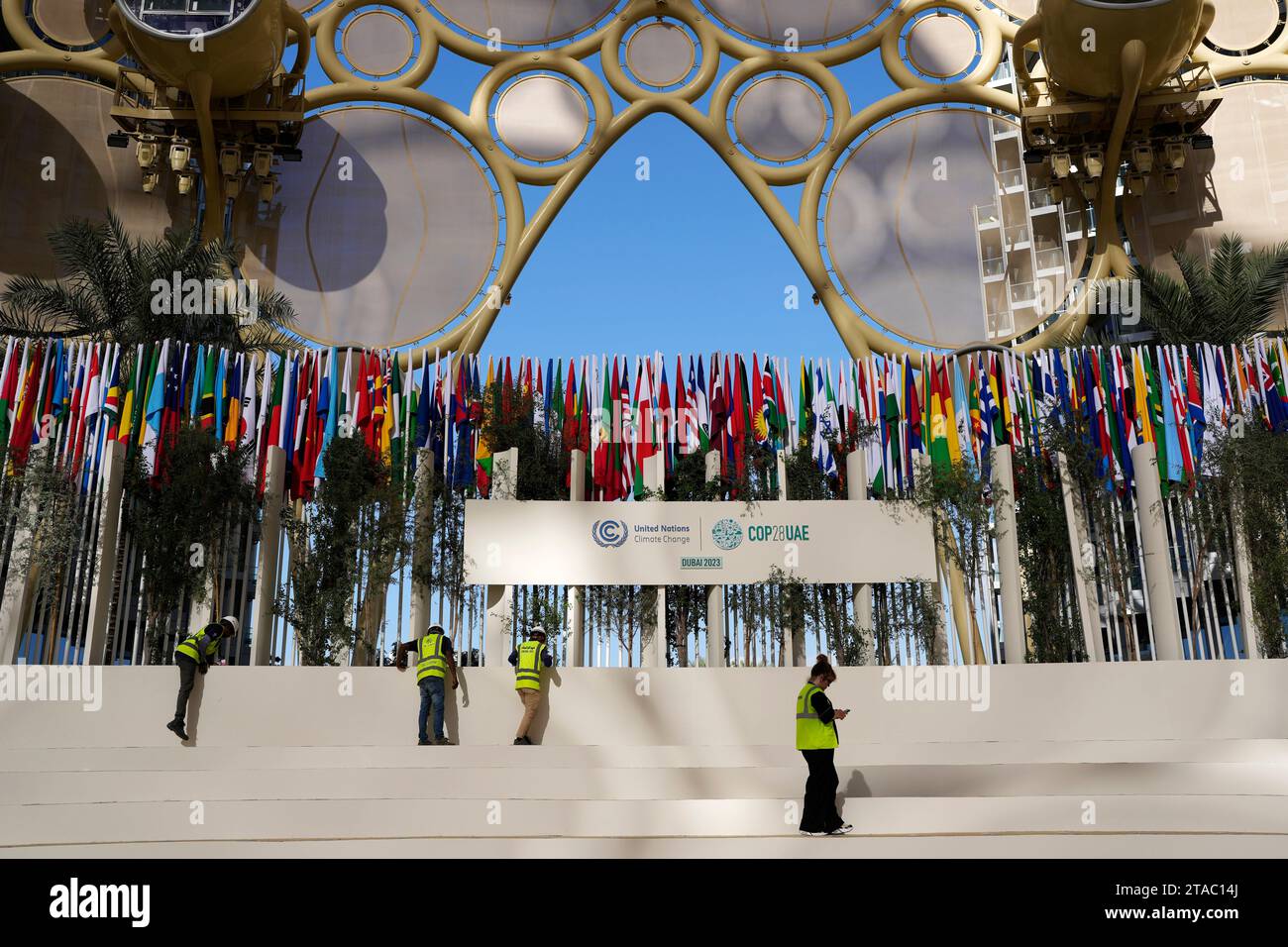 Workers prepare an area at the COP28 U.N. Climate Summit, Thursday, Nov ...