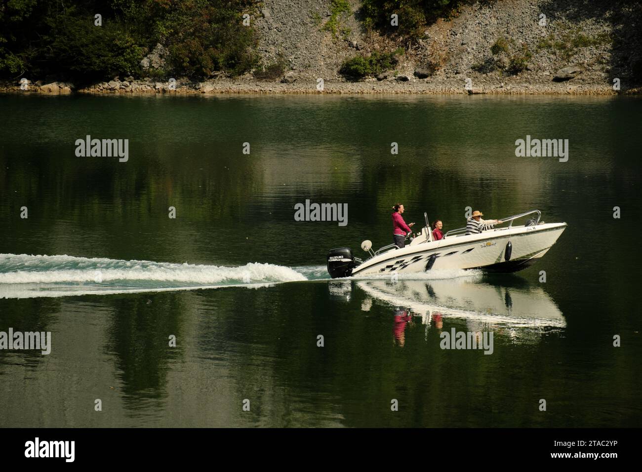 side view of speedboat and wake on Perucac Lake - Drina River, Bajina ...