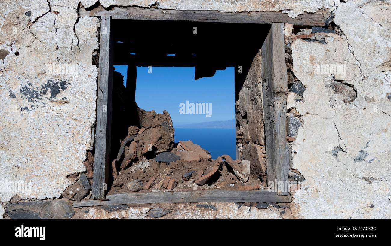 window of an old Canarian house, demolished and abandoned, from where ...